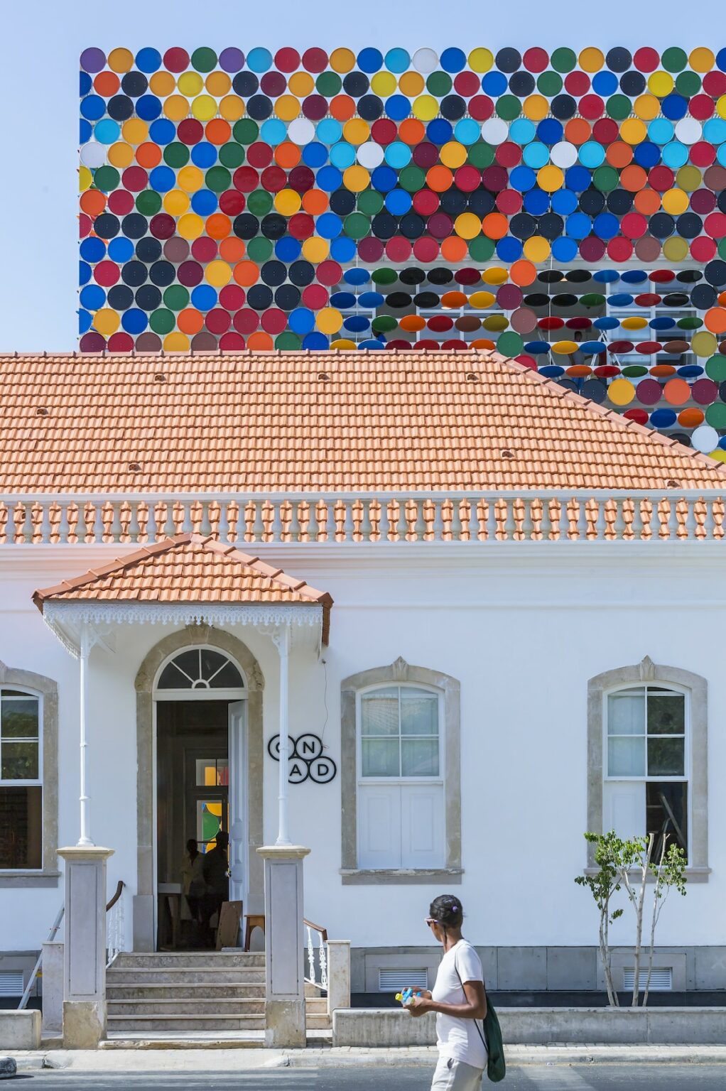 Architects Create Unique Façade From Colorful Recycled Barrel Lids ...